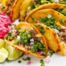 Savory Beef Birria Tacos dipped in broth - The Lemon Bowl®